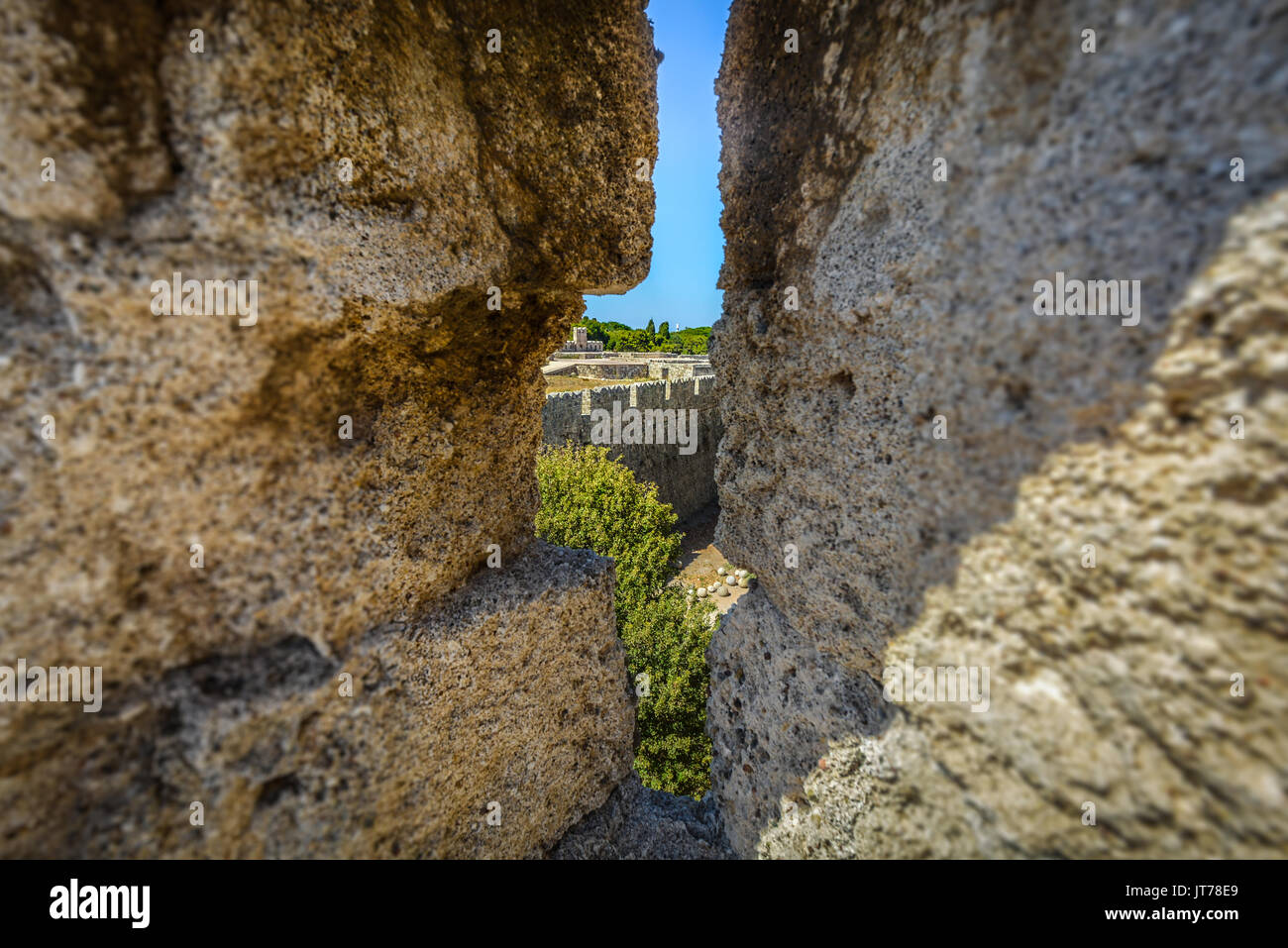 An arrow slit or arrowslit at the ancient Castle in Old Town Rhodes on ...