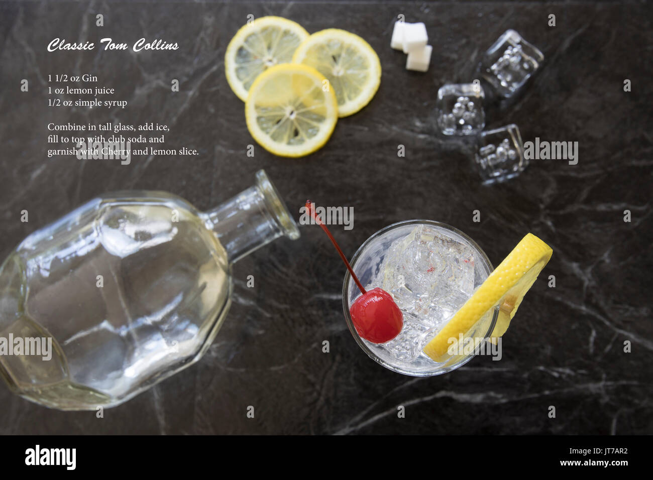 Classic Tom Collins cocktail in tall glass with cherry garnish and ...