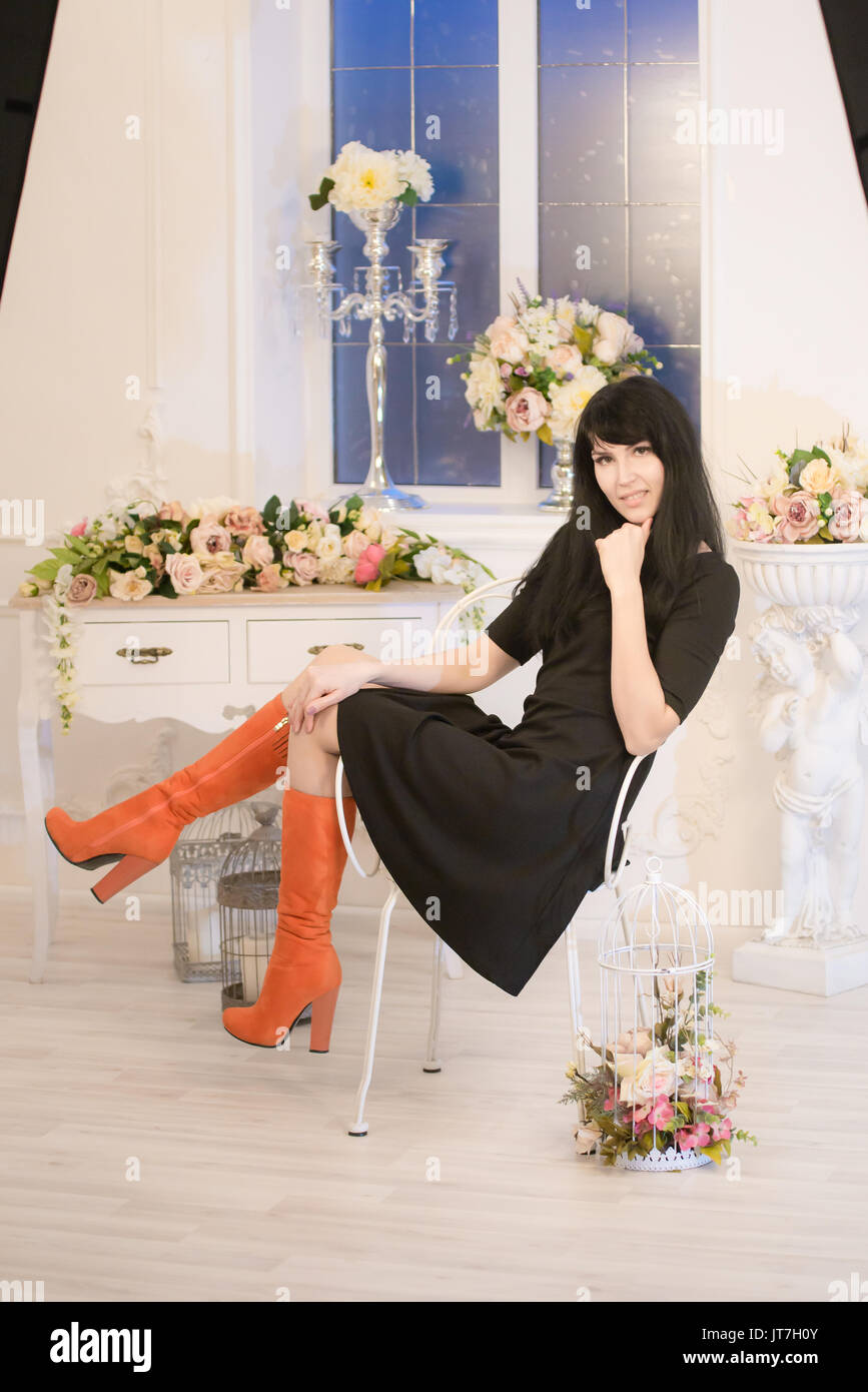 Charming young girl on a studio photo shoot Stock Photo - Alamy