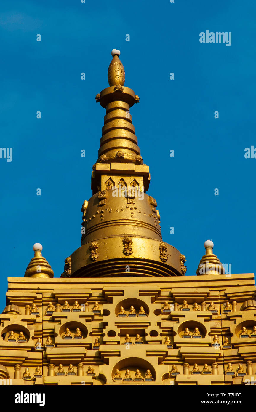 Golden Buddhist tower Stock Photo - Alamy