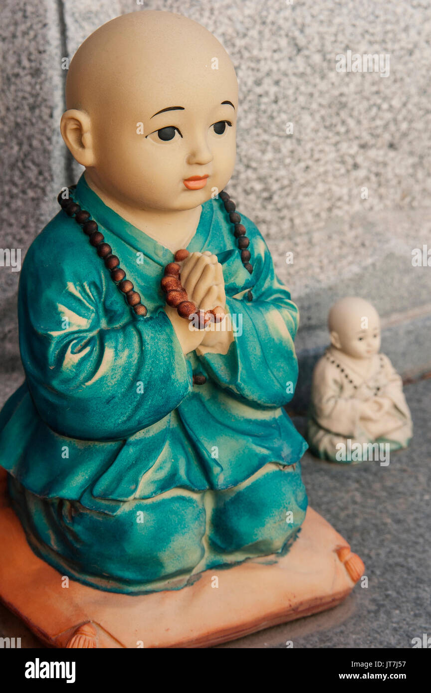 Baby monk sculpture Stock Photo - Alamy