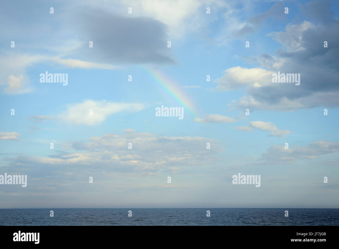 rainbow over New Jersey ocean on a summer afternoon Stock Photo - Alamy