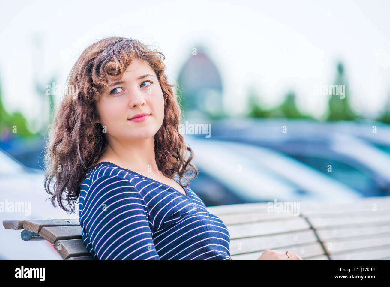 Anxious woman looking over her shoulder hi-res stock photography and ...