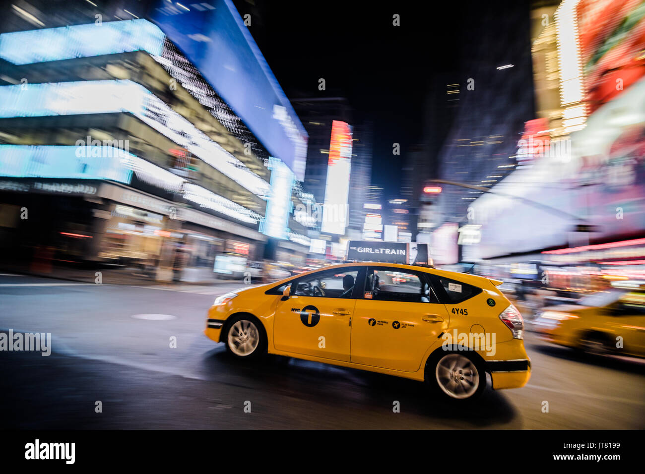 NEW YORK, USA - October 17, 2016. NYC Yellow Cab passing Fast at Night ...