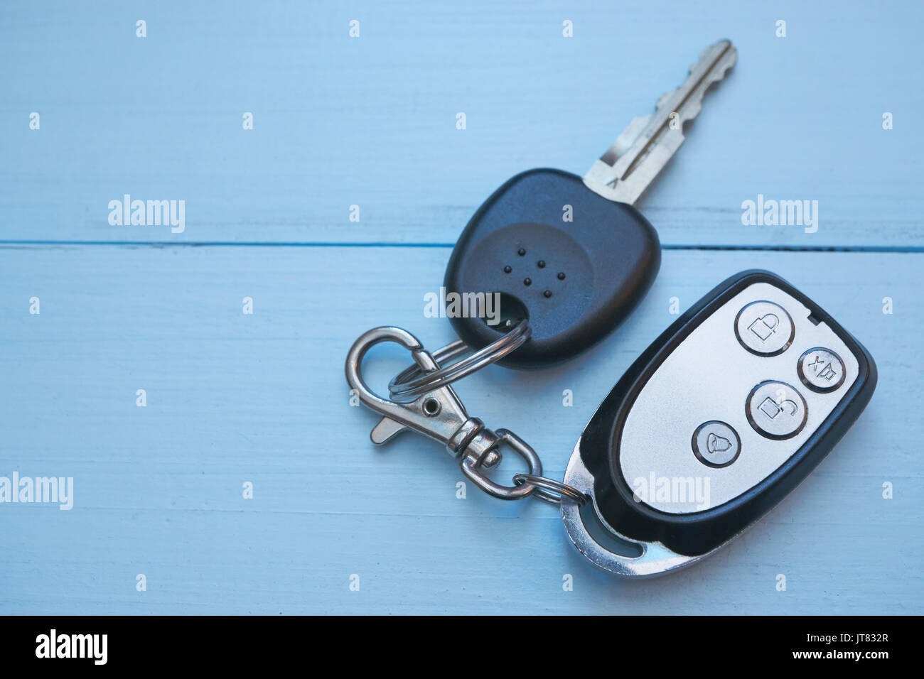 car keys with security alarm on blue desk. top view with lot of copy ...
