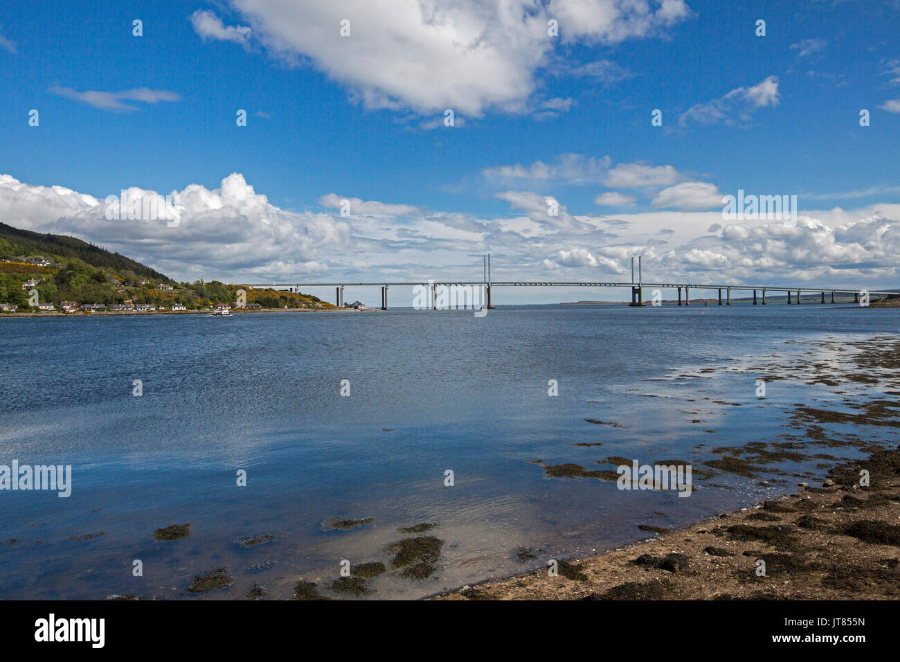 Kessock bridge over calm blue waters of estuary - Beauly Firth - under ...