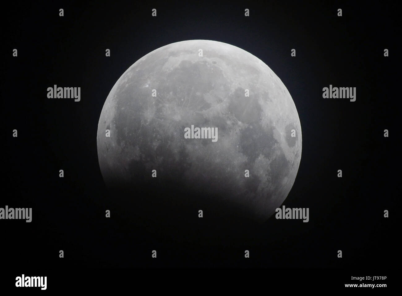 View of partial lunar eclipse seen. A partial lunar eclipse occurs when ...