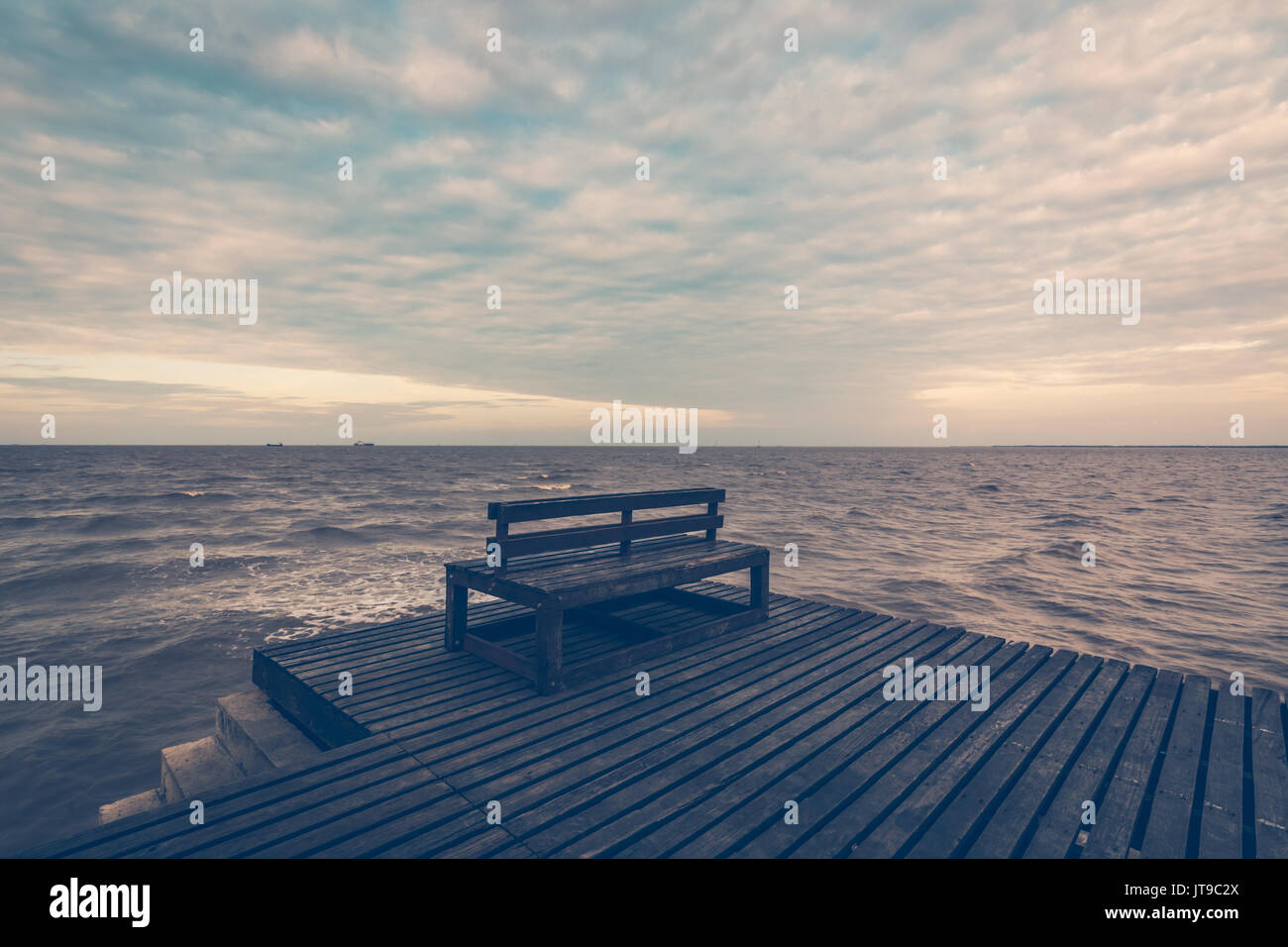 Wooden chair on wooden foot bridge Stock Photo - Alamy