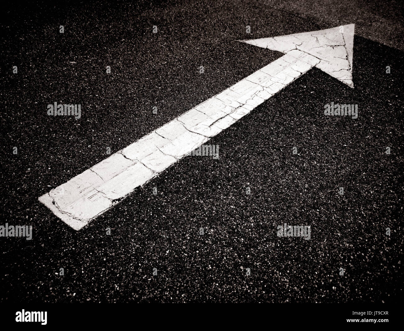 an image of an arrow sign on the road Stock Photo - Alamy