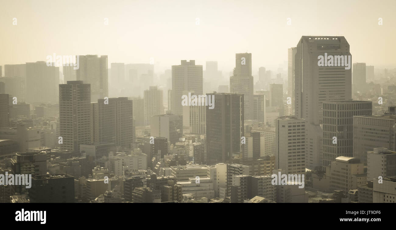 Cityscape at sunrise in the fog. Modern buildings at downtown in Tokyo ...