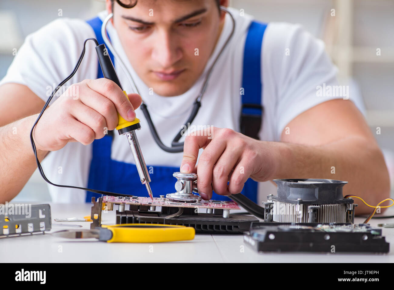 Computer repairman repairing desktop computer Stock Photo - Alamy