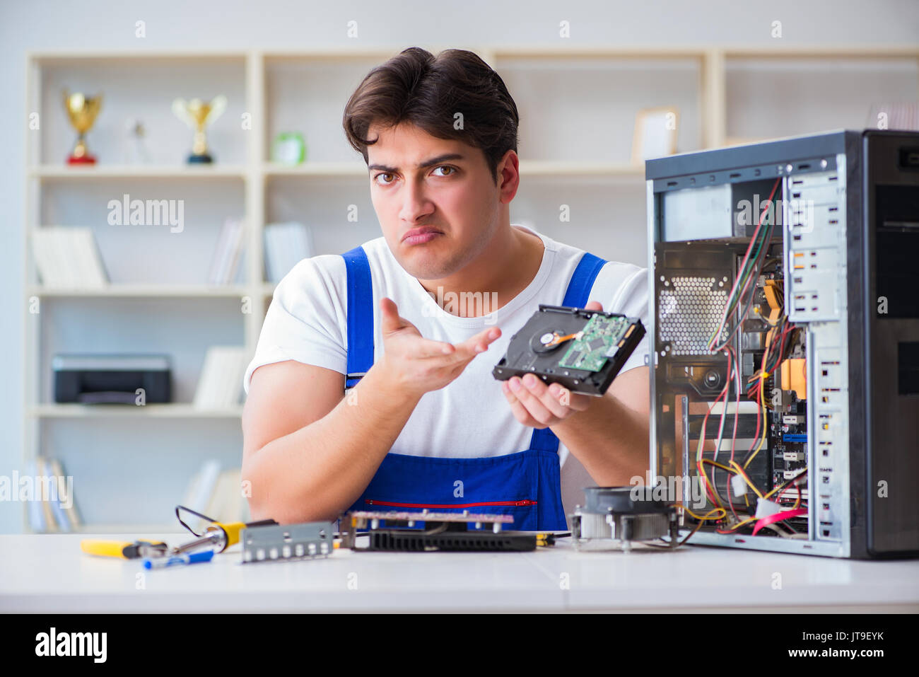 Computer repairman repairing desktop computer Stock Photo - Alamy