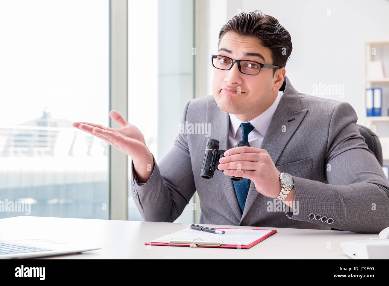 Man looking for errors and mistakes in report Stock Photo - Alamy