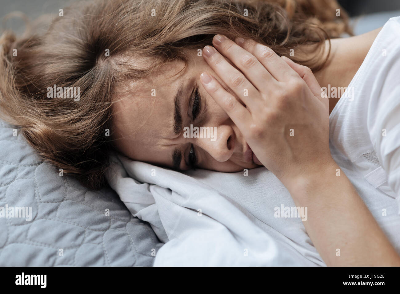 Sad young woman feeling depressed Stock Photo - Alamy