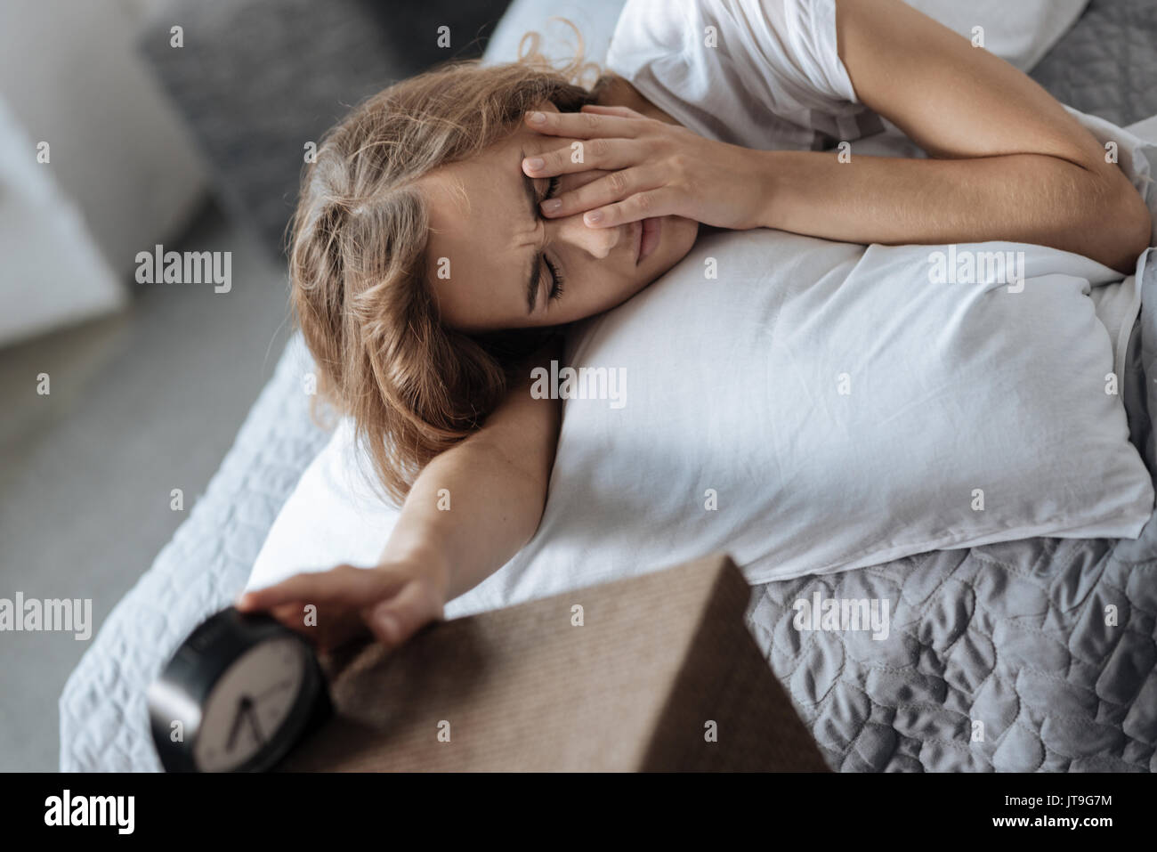 Sad sleepy woman trying to wake up Stock Photo - Alamy