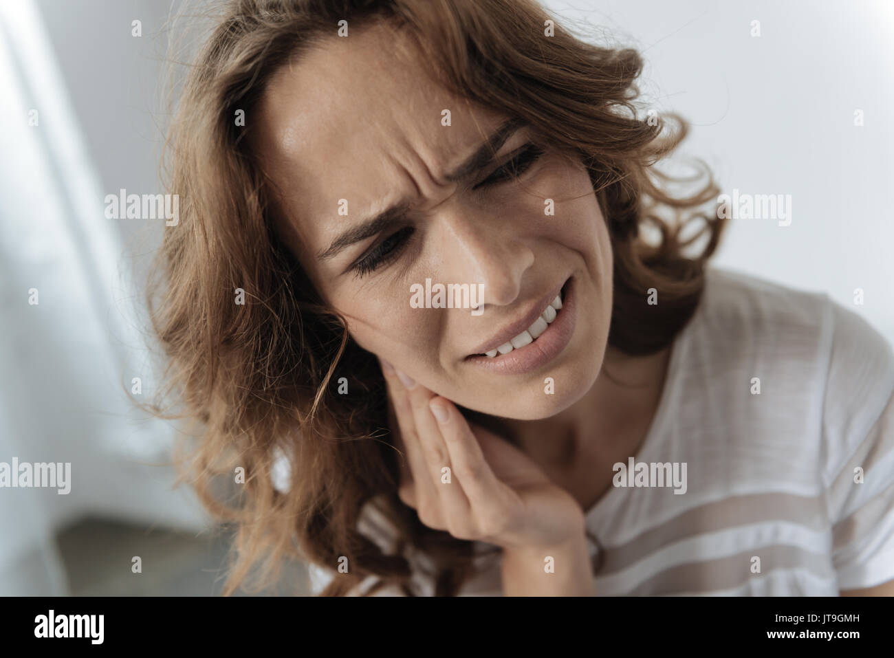 Cheerless beautiful woman suffering Stock Photo - Alamy