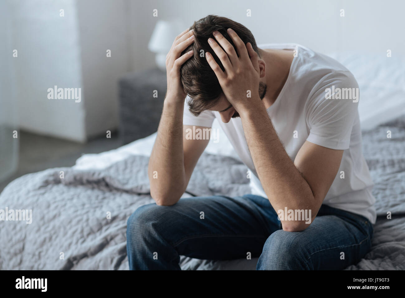 Unhappy handsome man feeling upset Stock Photo - Alamy