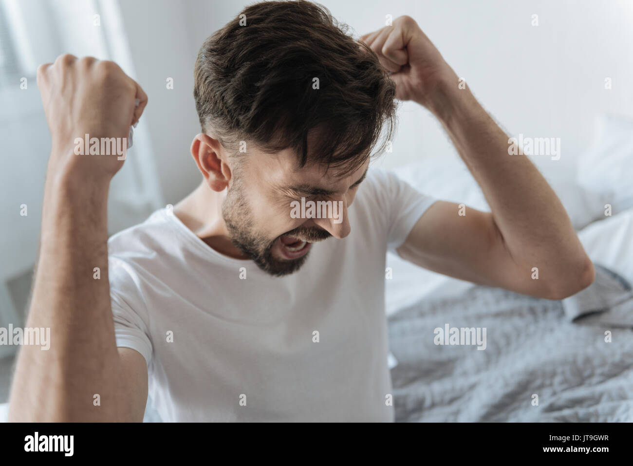 Cheerless angry man having a failure Stock Photo - Alamy