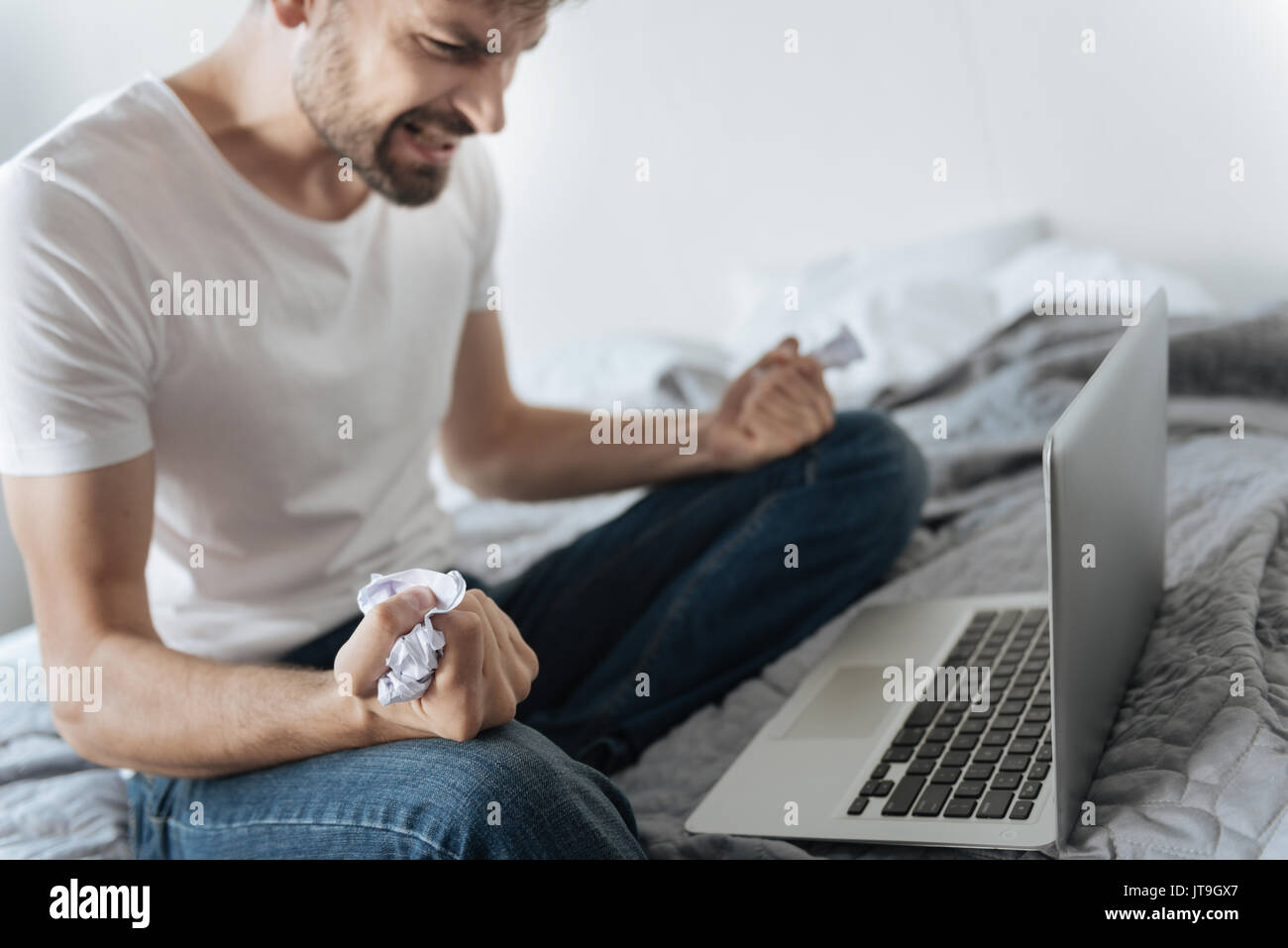 Piece of crumbled paper being in a mans hand Stock Photo - Alamy