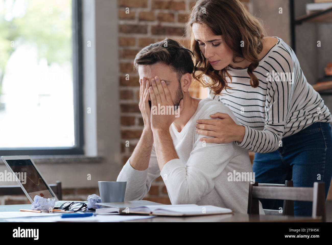 Caring supportive woman standing behind her boyfriend Stock Photo - Alamy