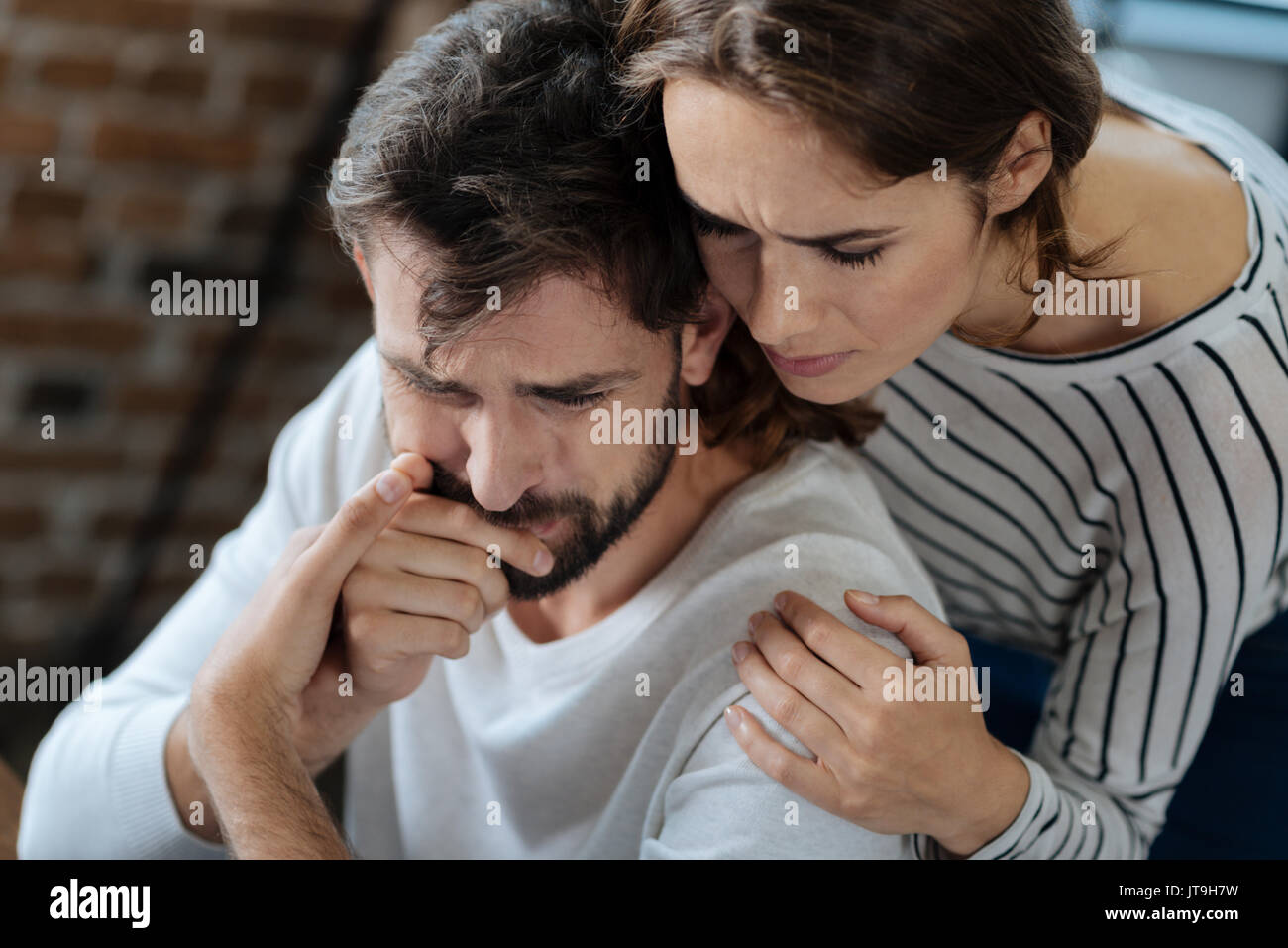 Pleasant caring woman hugging her boyfriend Stock Photo - Alamy