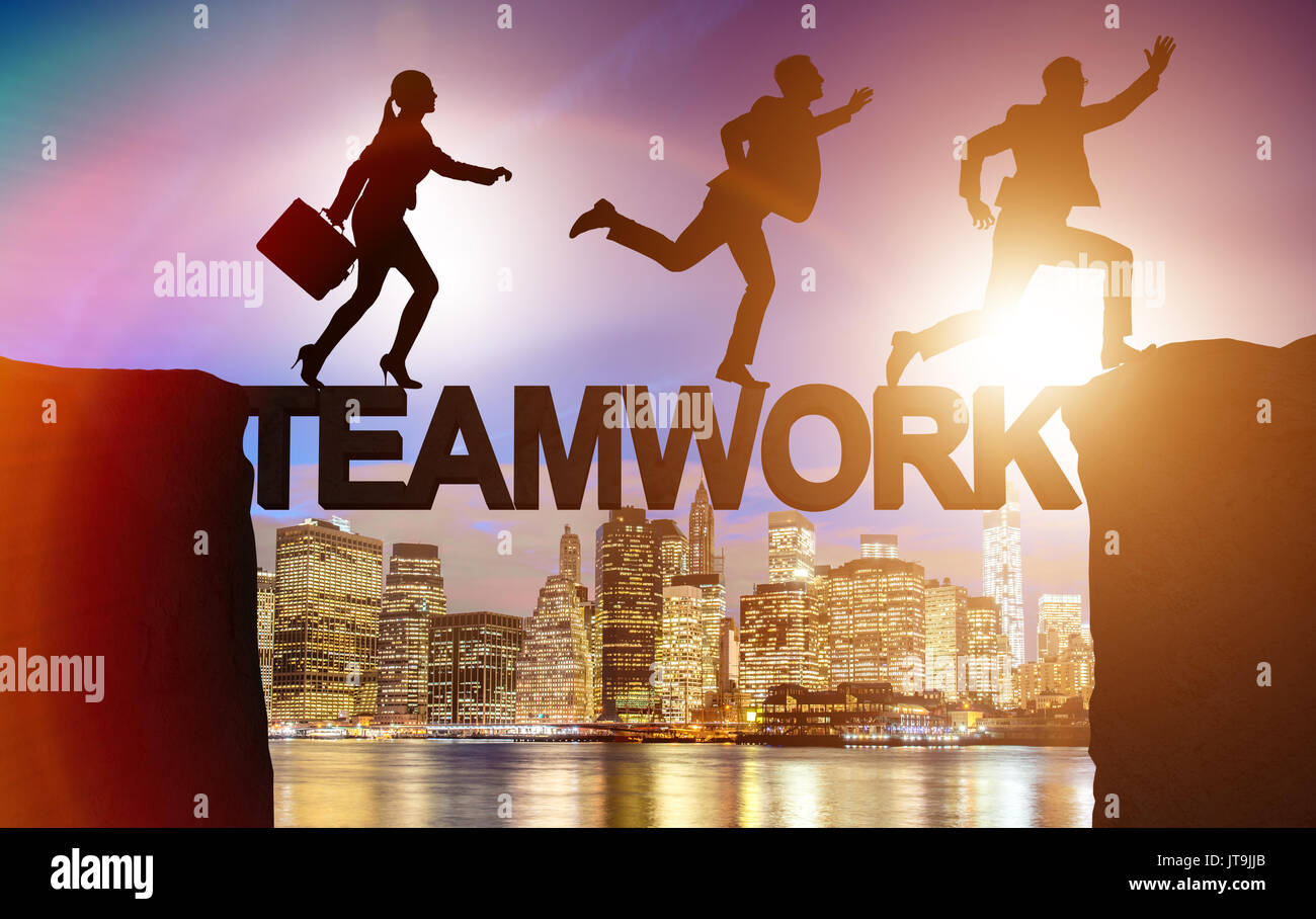 Teamwork concept with business people crossing bridge Stock Photo - Alamy