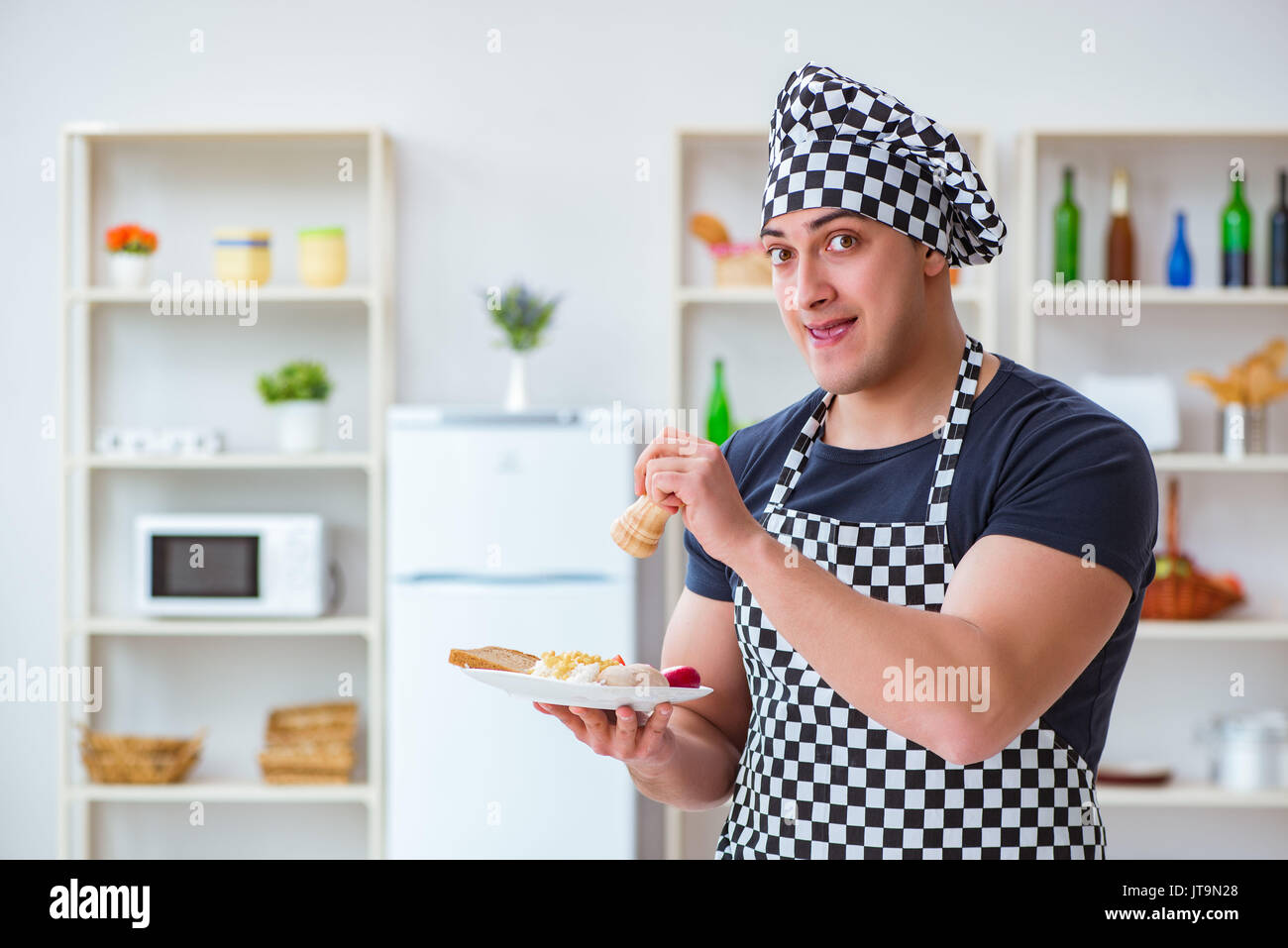 Chef cook cooking a meal breakfast dinner in the kitchen Stock Photo ...