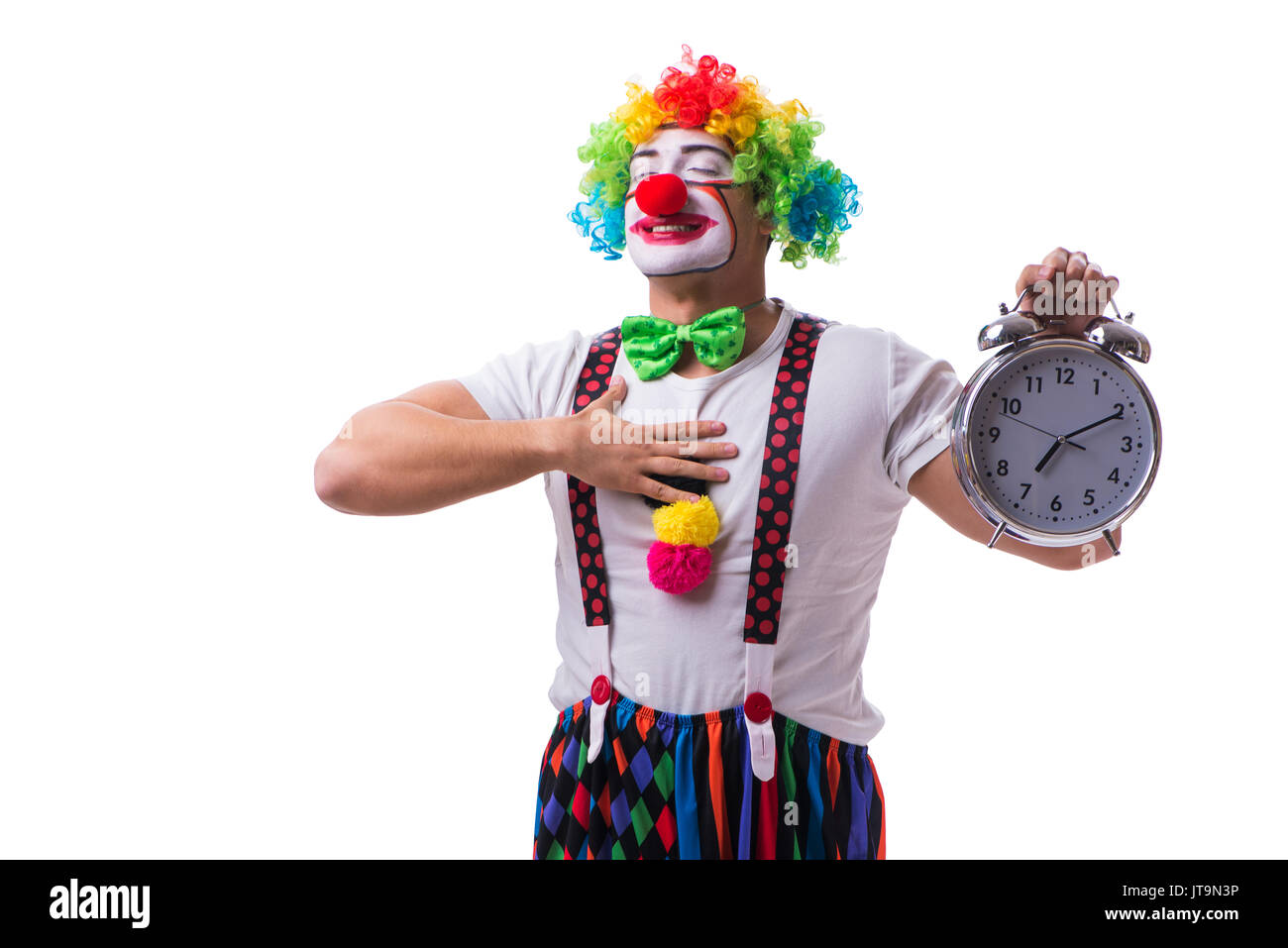 Funny clown with an alarm clock isolated on white background Stock ...