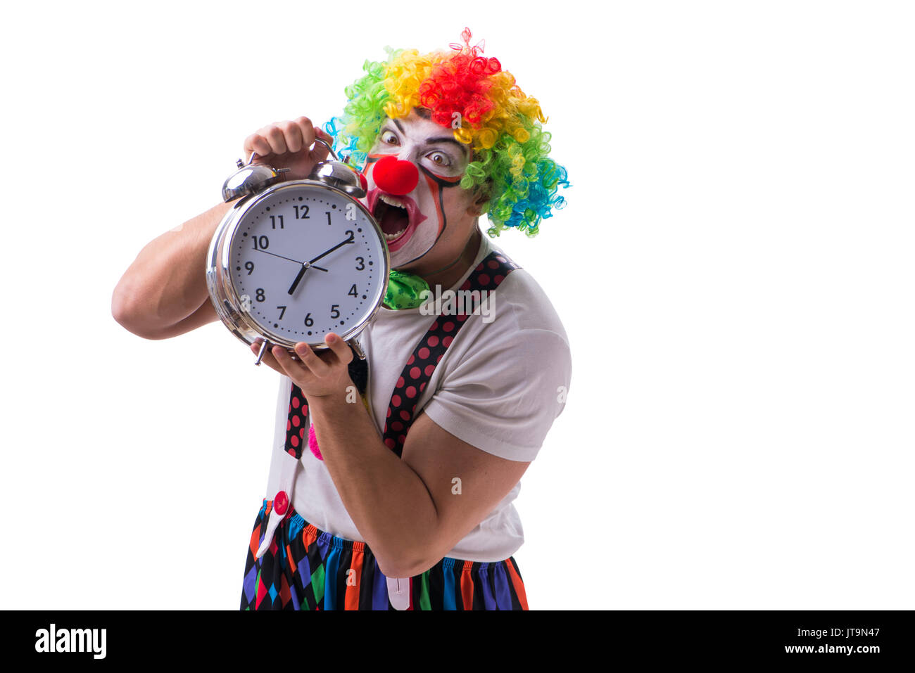 Funny clown with an alarm clock isolated on white background Stock ...