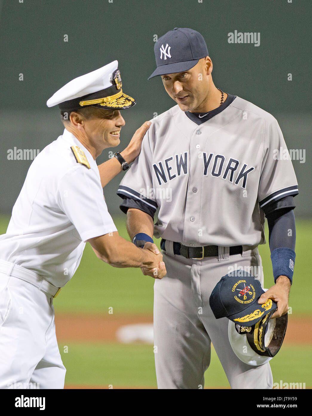 New York Yankees shortstop Derek Jeter (2) is presented a Captain's Hat ...