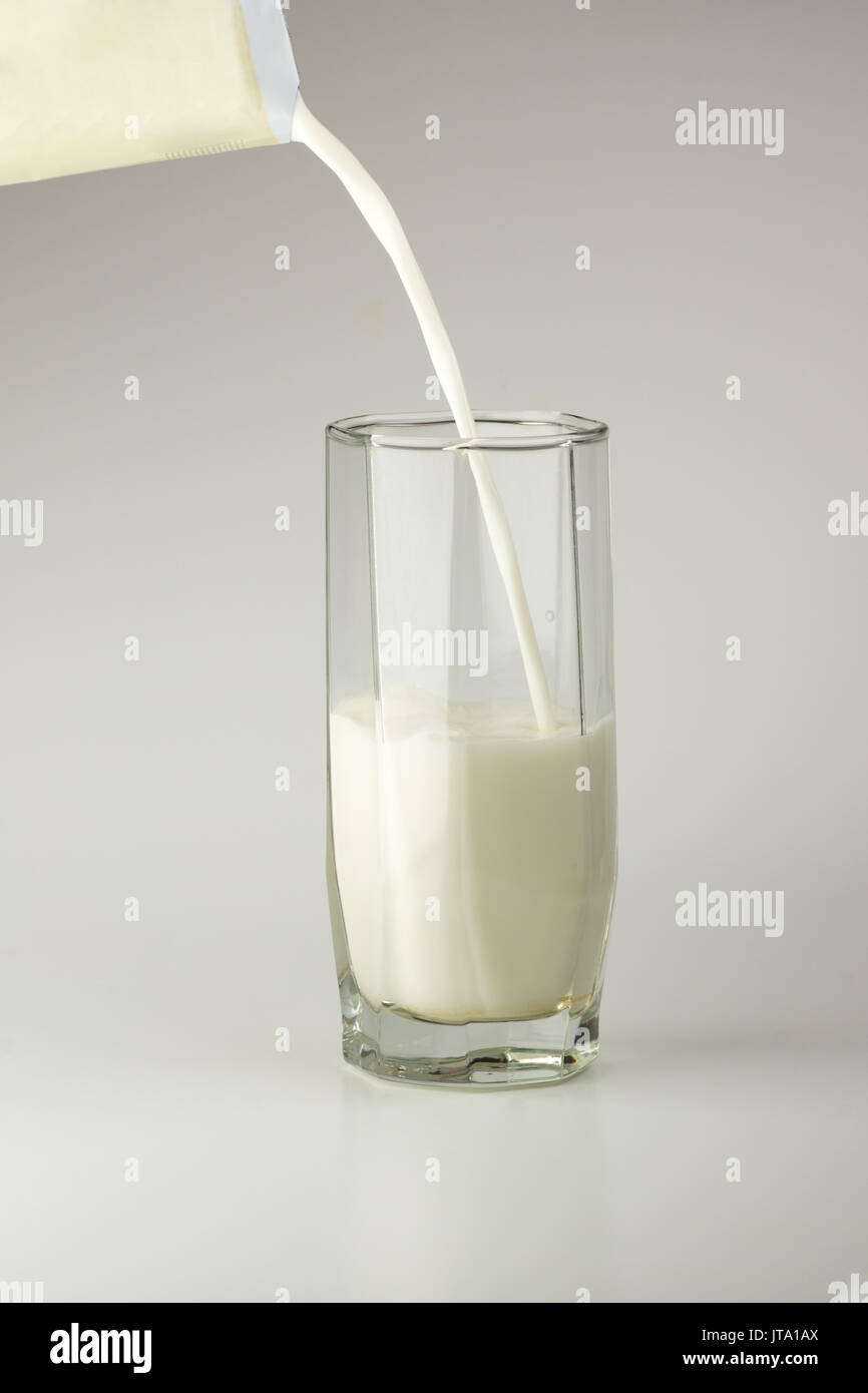 Pouring milk in white cup hi-res stock photography and images - Alamy