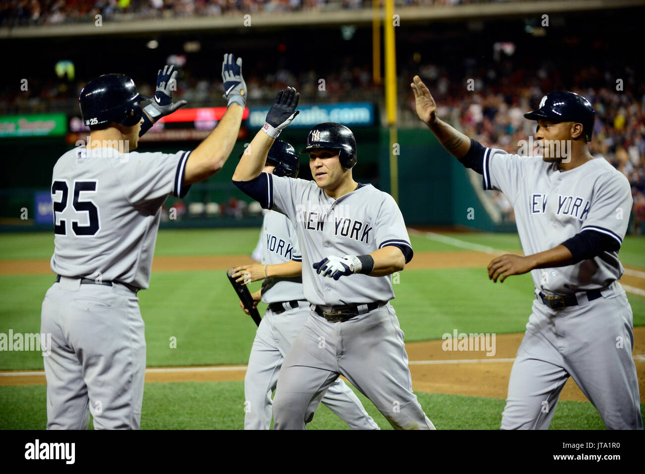 New York Yankees first baseman Mark Teixeira (25), left, congratulates ...