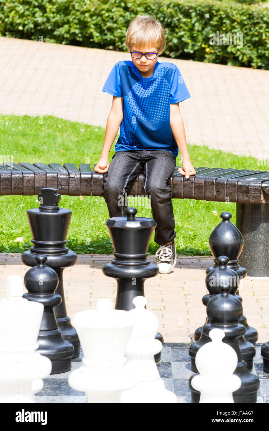 Child playing giant chess game hi-res stock photography and images - Alamy