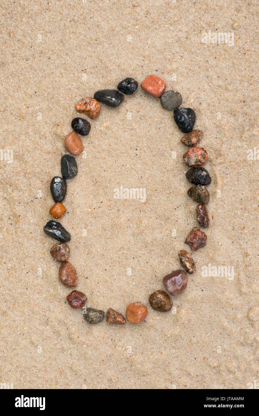 pebble 0 number on sand background selective focus Stock Photo - Alamy