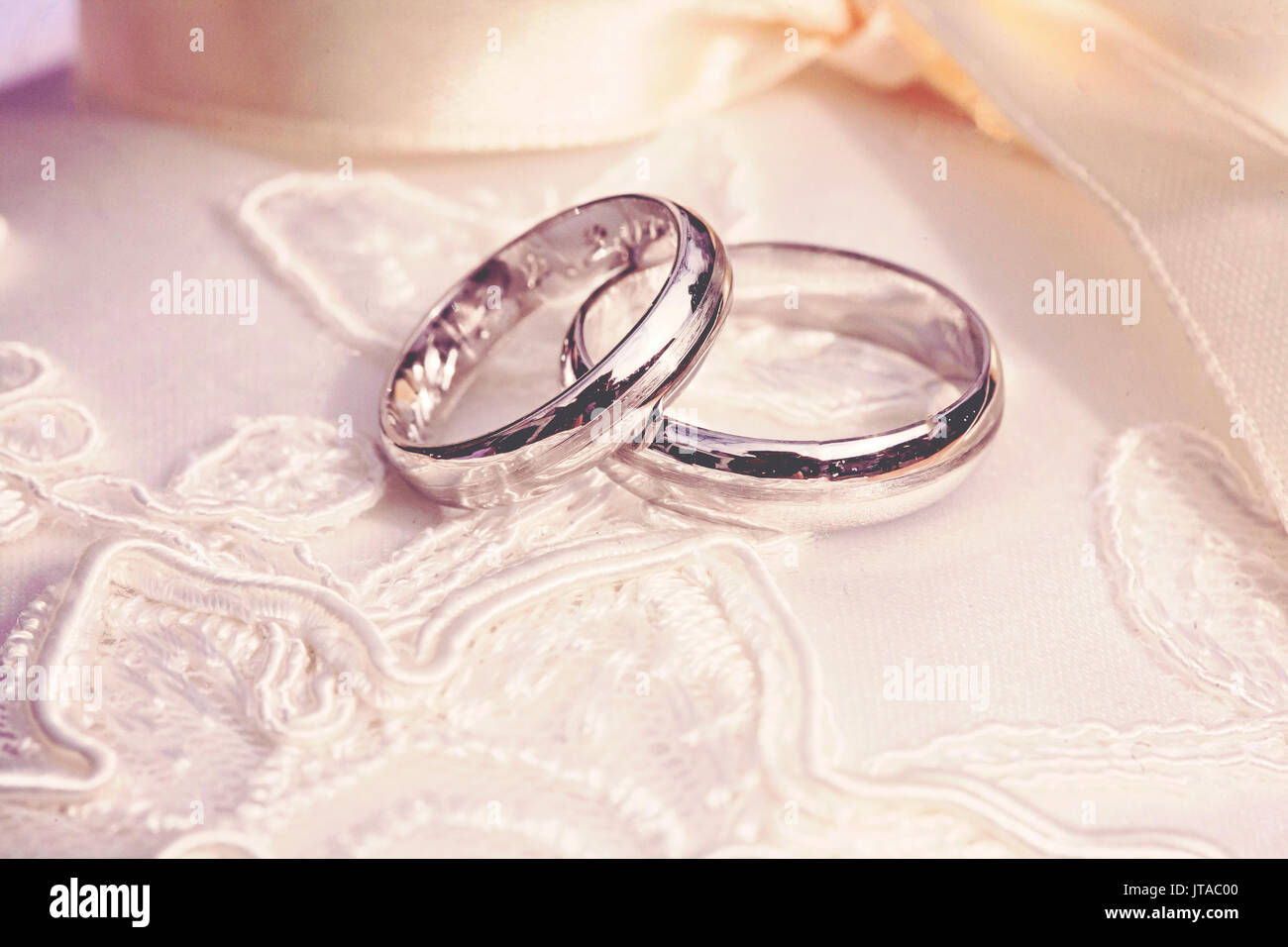 Wedding rings on beautiful background Stock Photo - Alamy