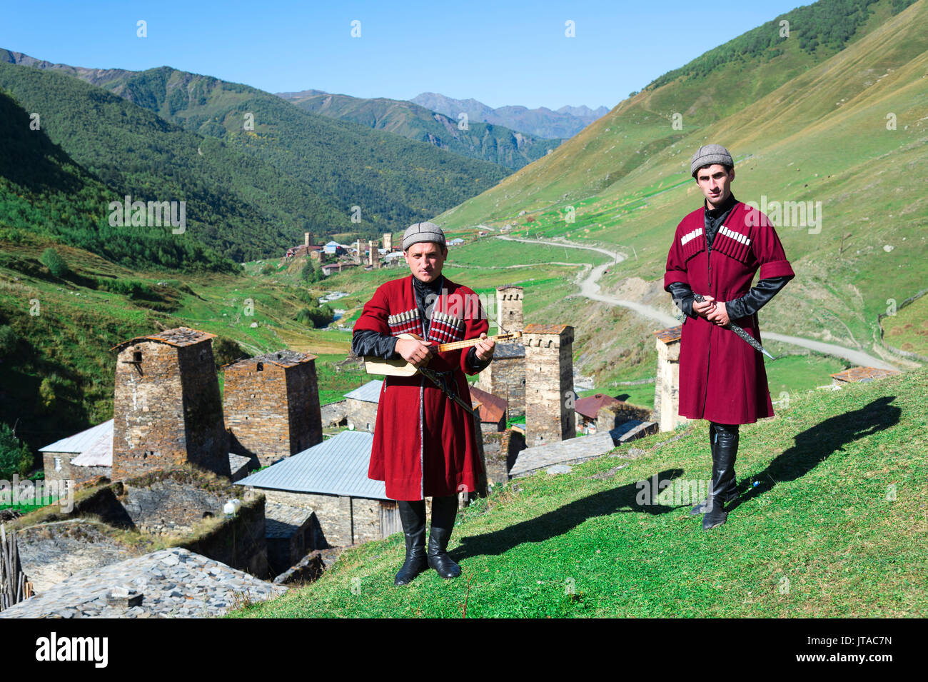 Georgian musicians in folkloric dress holding Panduri instrument and ...