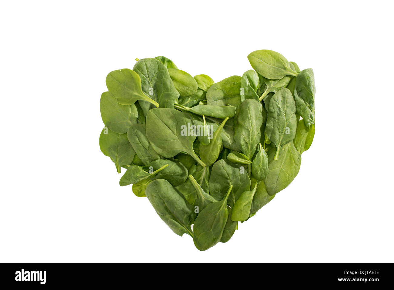 top view of heart shaped green spinach leaves isolated on white, food ...