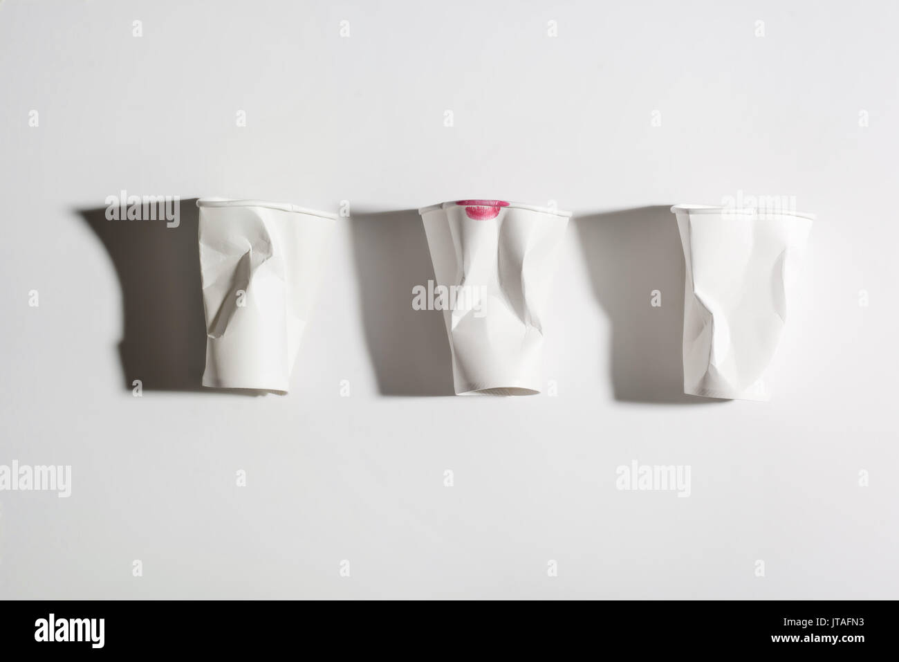 top view of three crumpled used paper cups isolated on white Stock ...