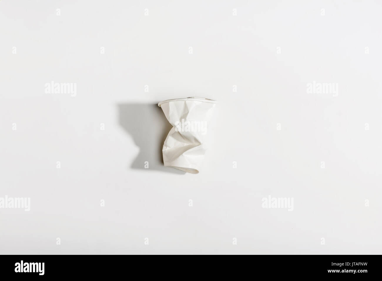 top view of one crumpled used paper cup isolated on white Stock Photo ...