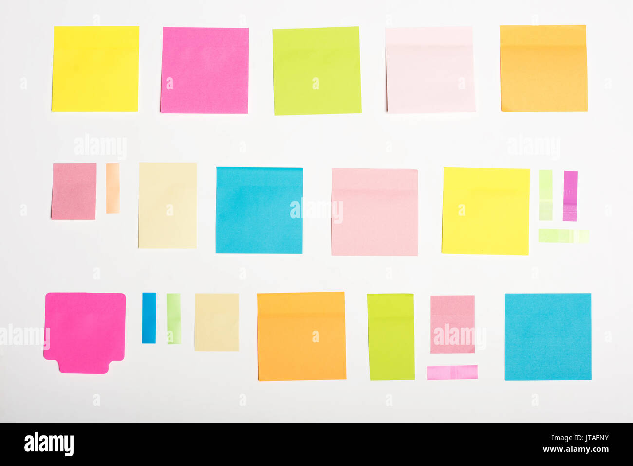 top view of different empty colorful sticky notes isolated on white ...