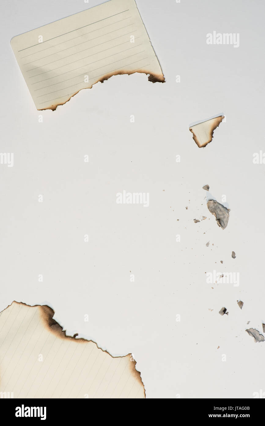 top view of pieces of empty writing paper sheet with burned edges Stock ...