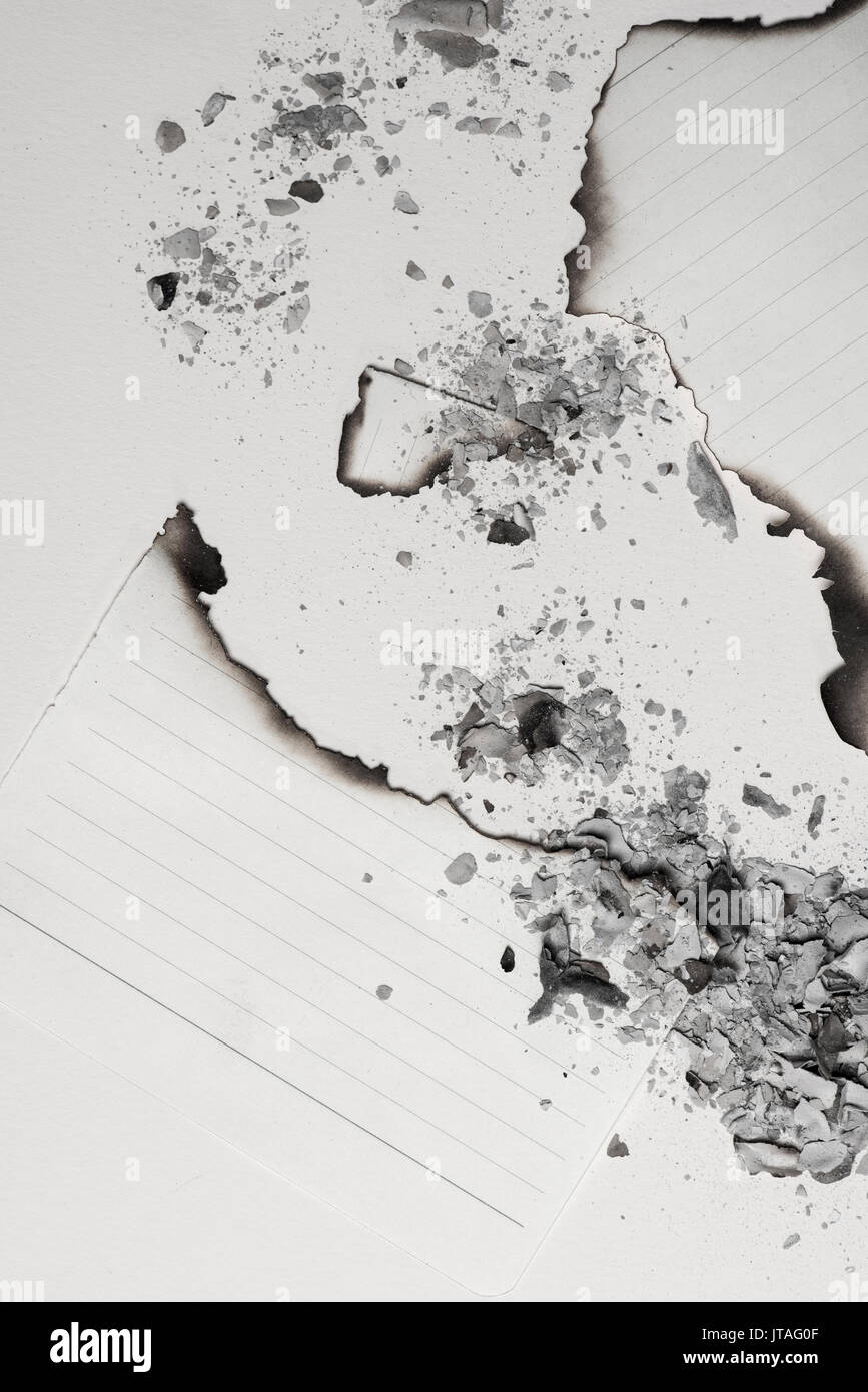top view of burned and tattered empty writing paper sheet Stock Photo ...