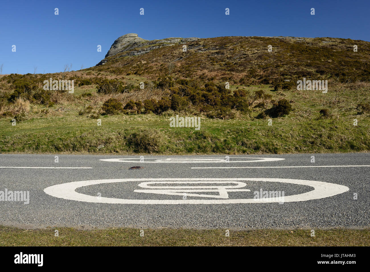 Elongated speed limit sign on a road across Dartmoor Stock Photo - Alamy