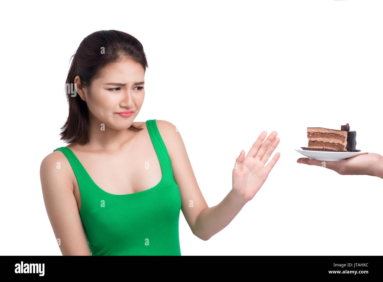 Sad face of asian young woman do not like cake isolated on white ...