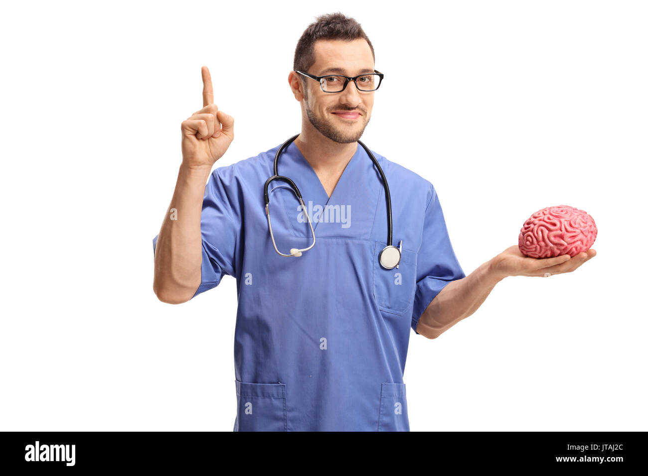 Doctor holding a brain model and pointing up isolated on white ...