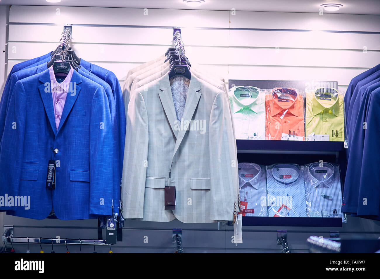 Men's jackets on hangers in the men's store Stock Photo - Alamy