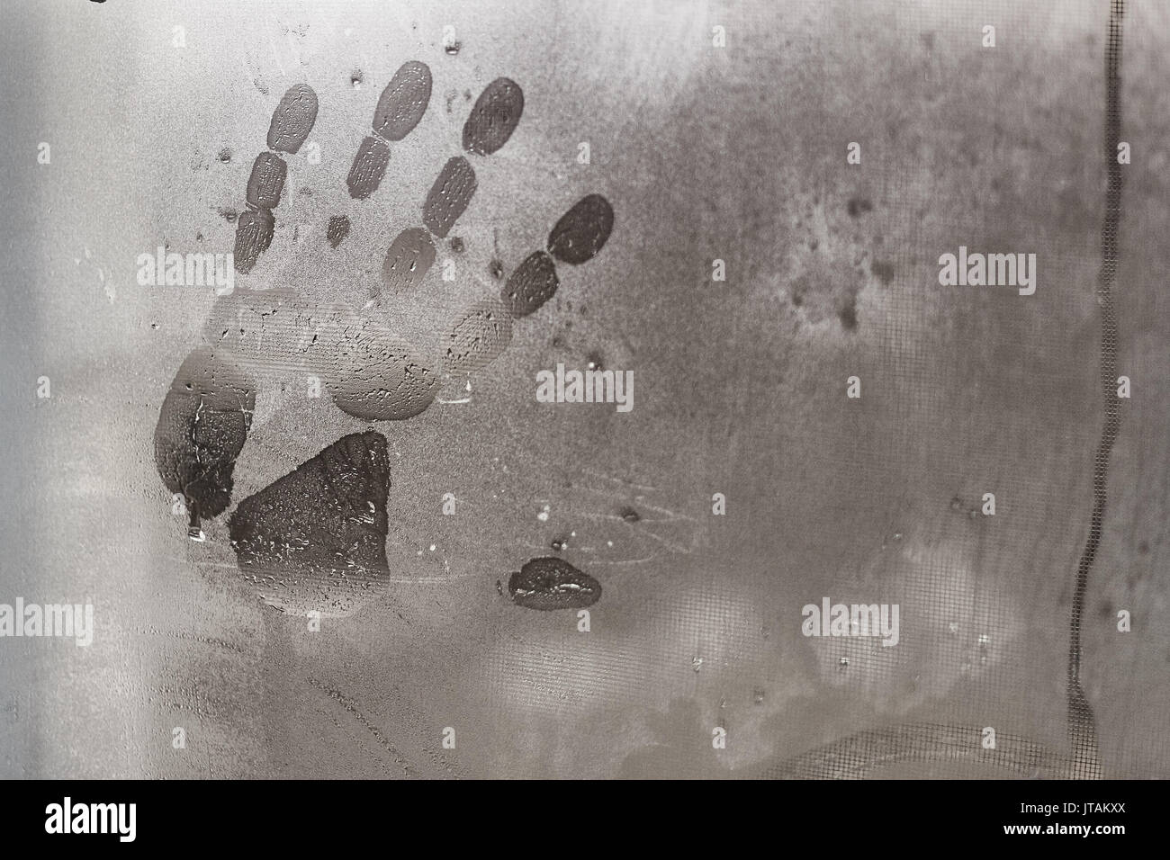Palm print on a foggy window Stock Photo - Alamy