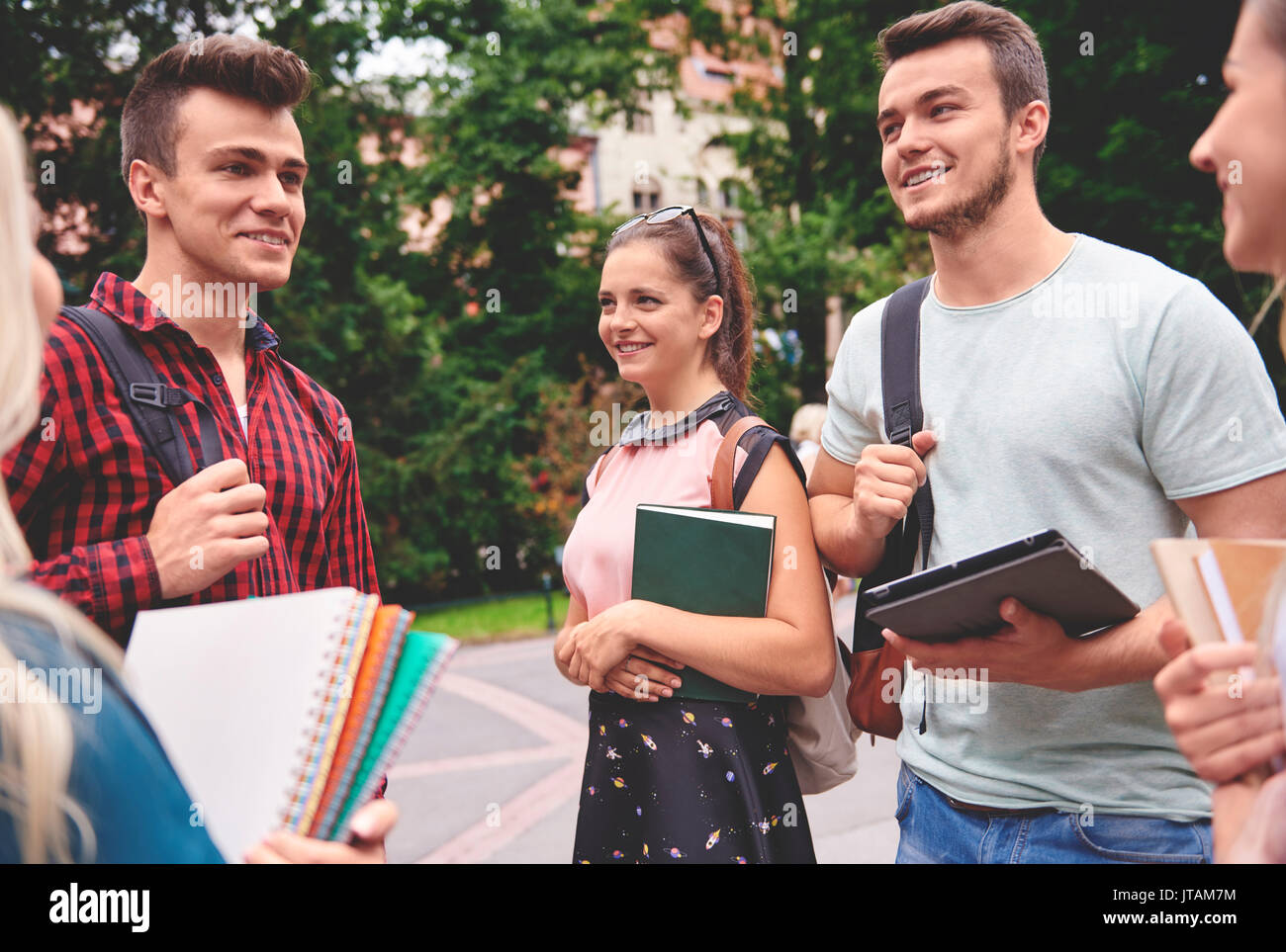 Group of students meeting outdoors Stock Photo - Alamy