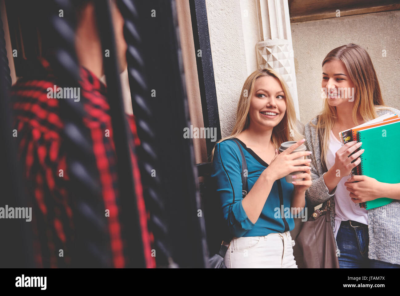 Young students during break outside Stock Photo - Alamy