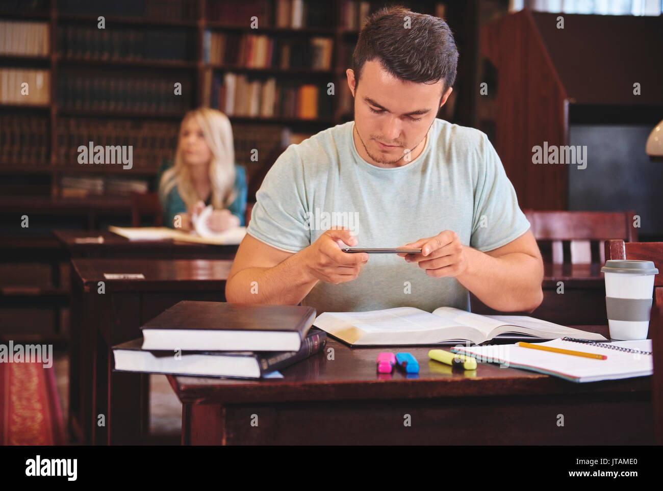 Male studying with his smartphone Stock Photo - Alamy